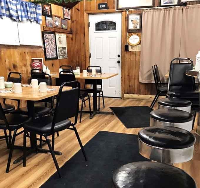 Wood paneling and simple seating create the kind of cozy atmosphere where strangers become friends over coffee refills.