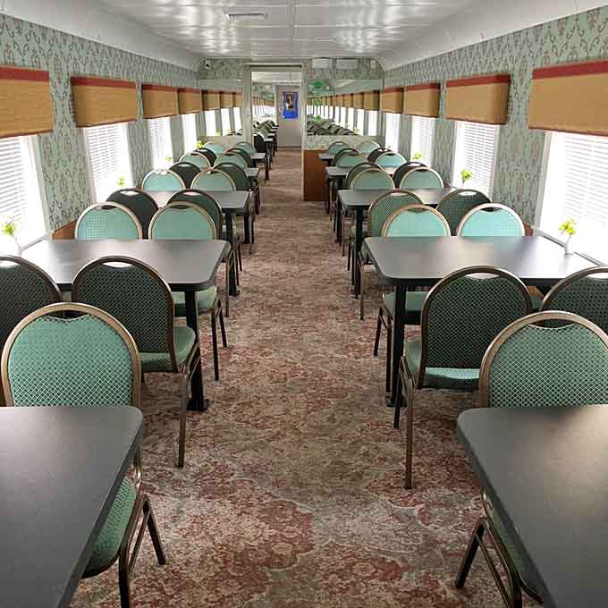 The vintage dining car's classic setup creates an intimate atmosphere where every table has a front-row seat to the unfolding mystery.