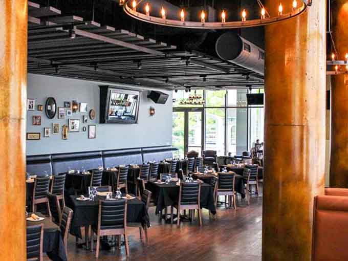Industrial chic meets dinner theater, where exposed beams and candlelight set the stage for delicious deception.