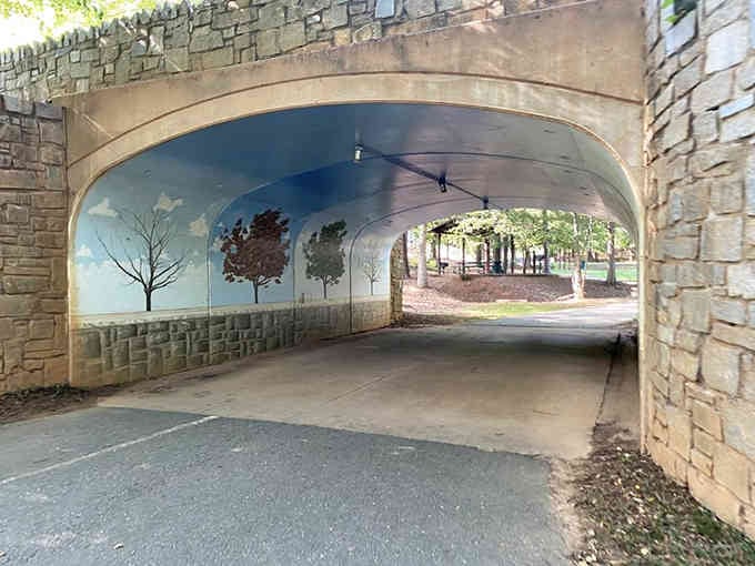 This painted tunnel leads to canine paradise, proving that the journey can be just as beautiful as the destination.