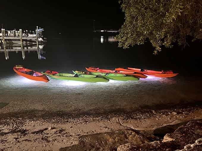 Lined up like neon dreams waiting to happen, each kayak promises its own underwater light show tonight.