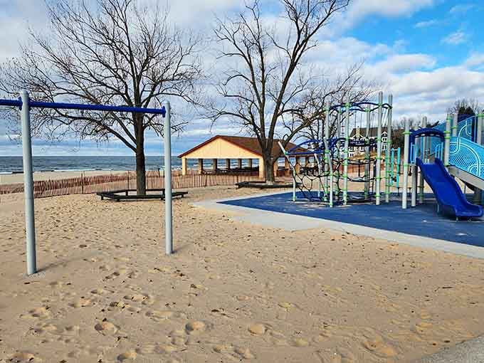 The playground sits right on the sand, proving someone actually thought about what families need at the beach.