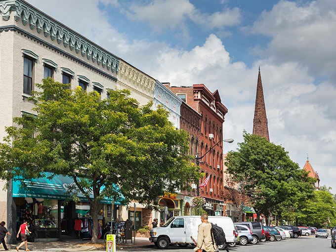 Tree-lined streets and church spires create the kind of walkable downtown that makes car ownership optional.