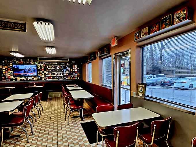 Red chairs and checkered floors create the kind of timeless atmosphere that makes smartphones feel unnecessary.