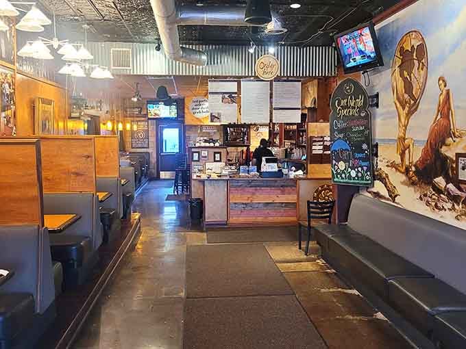 Industrial chic meets neighborhood warmth, where corrugated ceilings and wooden booths create the perfect breakfast sanctuary.