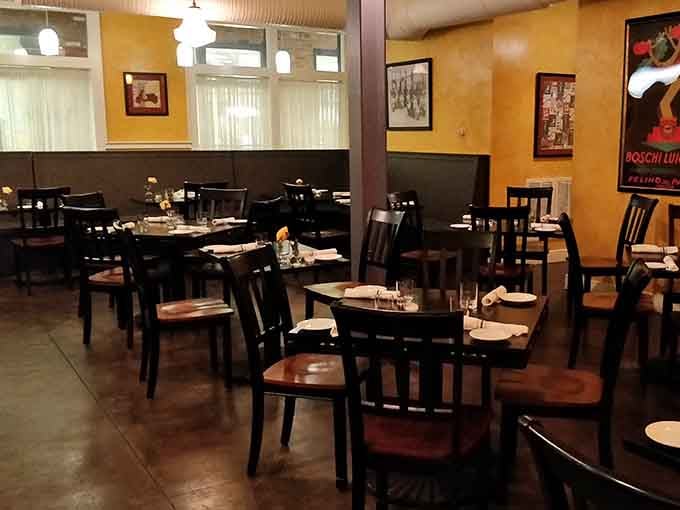 Warm lighting and thoughtfully spaced tables create an atmosphere where conversations flow as smoothly as the wine.