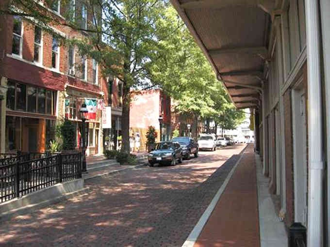 Brick streets and shaded sidewalks invite leisurely strolls through a downtown that remembers its manners.