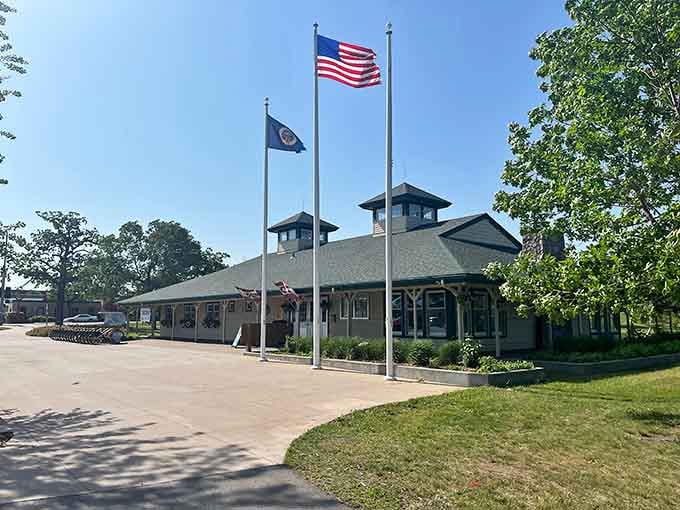 The visitor center flies the flags proudly, welcoming travelers to discover the legend of the North Woods.