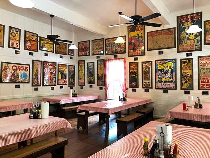 Vintage circus posters and checkered tablecloths create an atmosphere that's equal parts nostalgia and pure Southern hospitality.