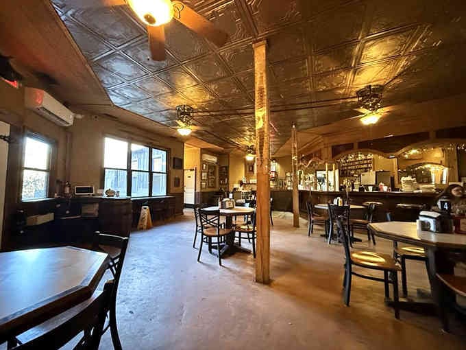 That pressed tin ceiling gleaming above the bar proves even cave restaurants appreciate a touch of old-fashioned elegance and charm.
