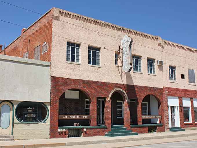 These brick arches frame downtown businesses with architectural charm that modern strip malls can only dream about.