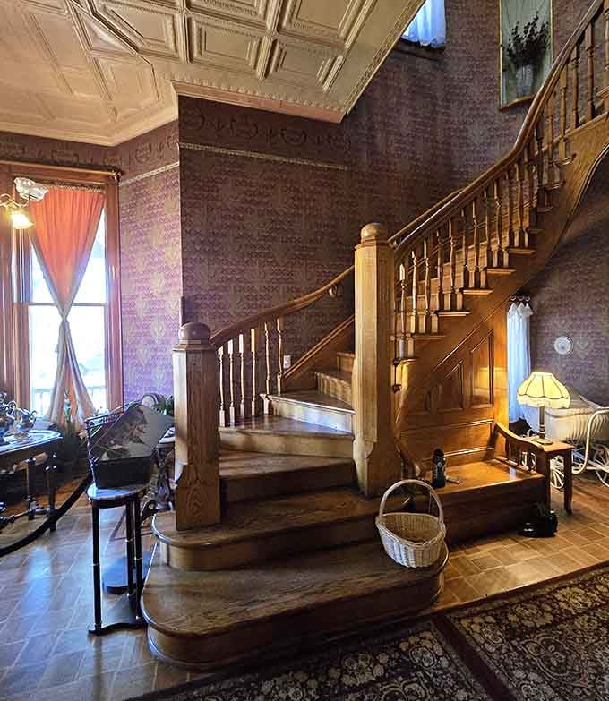 That staircase alone is worth the admission, curving upward like something from a Hollywood golden age film.