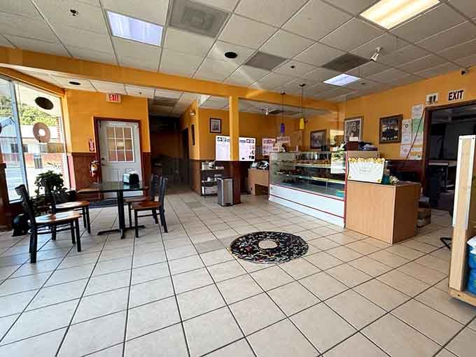 Step inside where yellow walls and tile floors create the kind of welcoming vibe every donut shop should have.