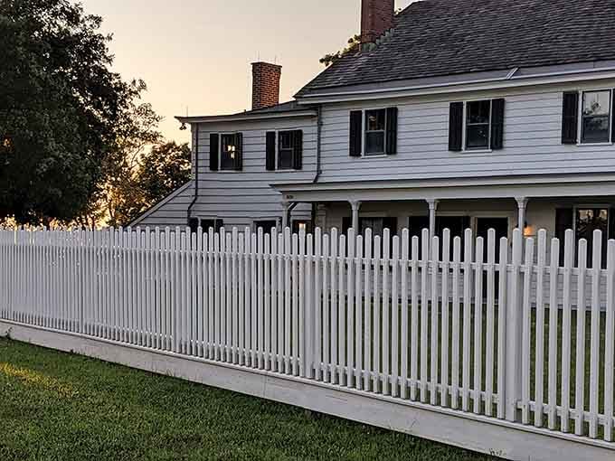 That white picket fence is doing a lot of heavy lifting, trying to make three centuries of hauntings look downright neighborly.