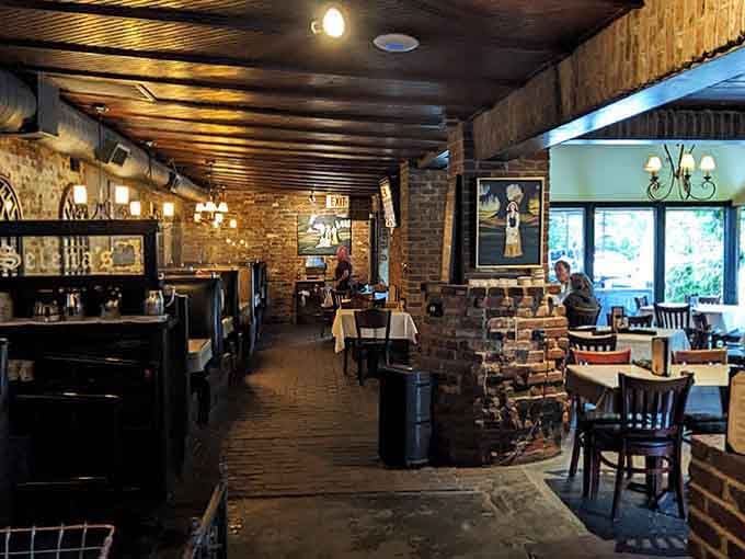 Exposed brick and warm lighting create an atmosphere where everyone looks good and the food tastes even better.