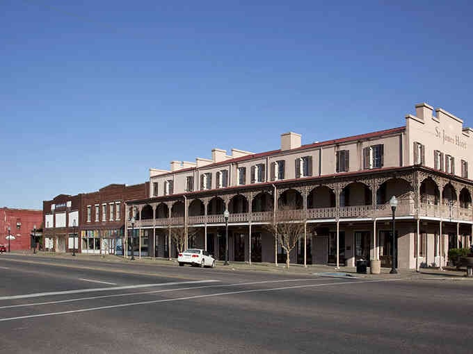 The St. James Hotel's ornate ironwork balconies whisper tales of Southern elegance and sweet tea afternoons.