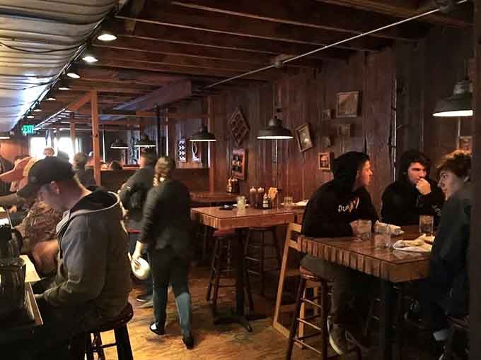 Wood-paneled walls and pendant lights create the perfect atmosphere for serious meat consumption and even more serious conversation.
