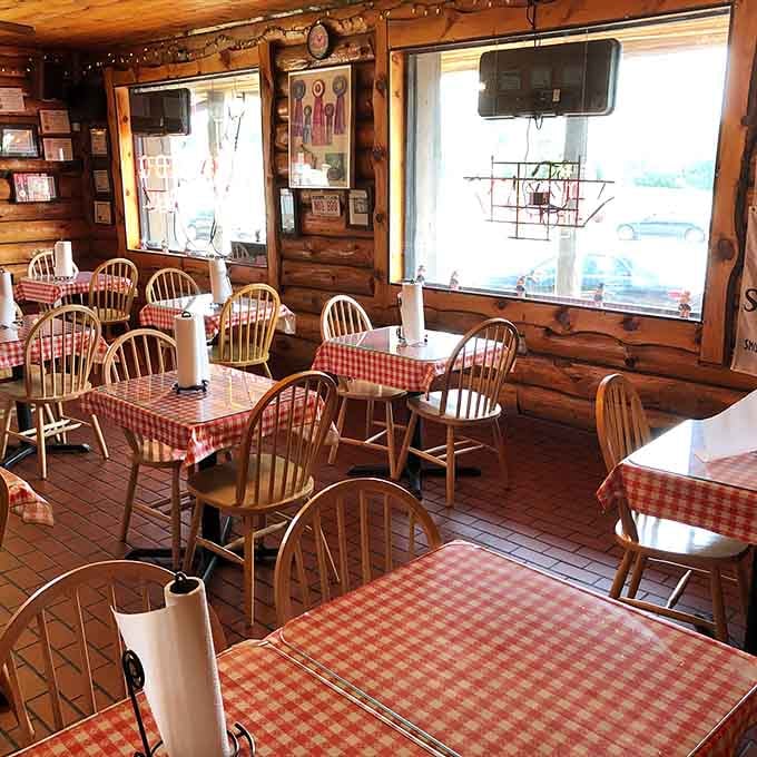 Red-and-white checkered tablecloths and wood-paneled walls create the kind of cozy atmosphere where great meals happen naturally.