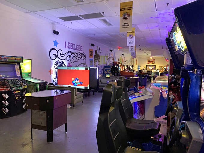 The purple glow and comfortable seating prove arcades have evolved beyond sticky floors and questionable snack choices.