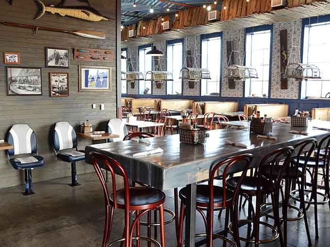 Industrial-chic meets coastal comfort in this spacious dining room where every seat promises a great meal ahead.