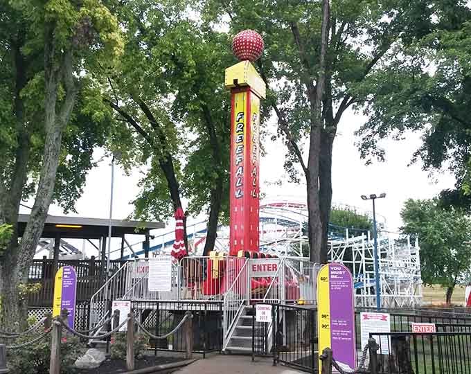 The free fall tower stands ready to test your courage and possibly make you reconsider that last hot dog.