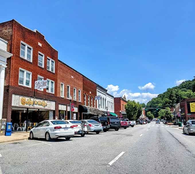 Brick buildings and local shops lining streets that remember when downtowns were the heart of everything.