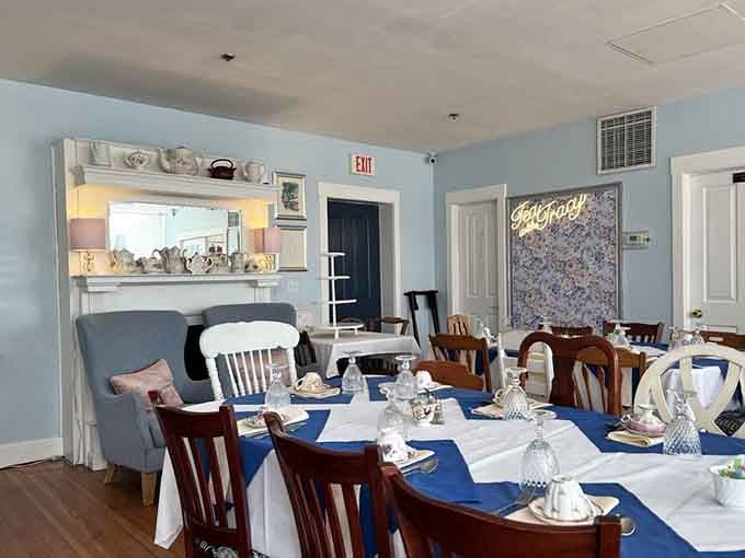 Step into a space where soft blue walls and mismatched chairs create the coziest fairy tale setting.