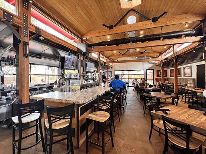 Exposed beams and warm wood create an atmosphere where rustic charm meets modern gastropub sophistication beautifully.