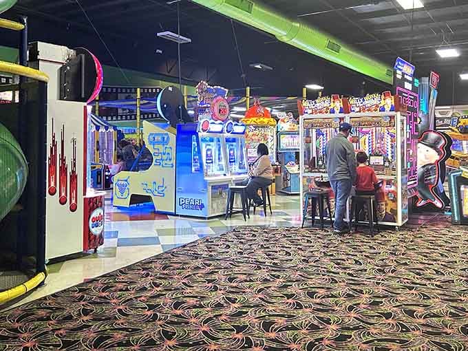 This arcade stretches into the distance like a neon-lit promise that your kids will sleep well tonight.