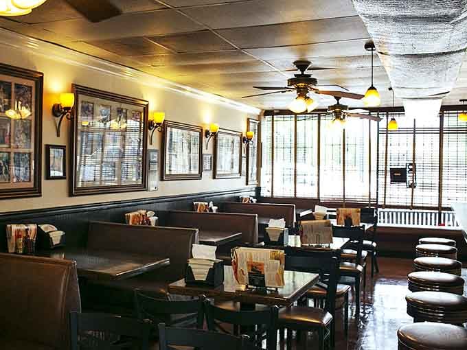 Step inside where yellow walls and vintage photographs create an atmosphere warmer than the fried chicken waiting for you.