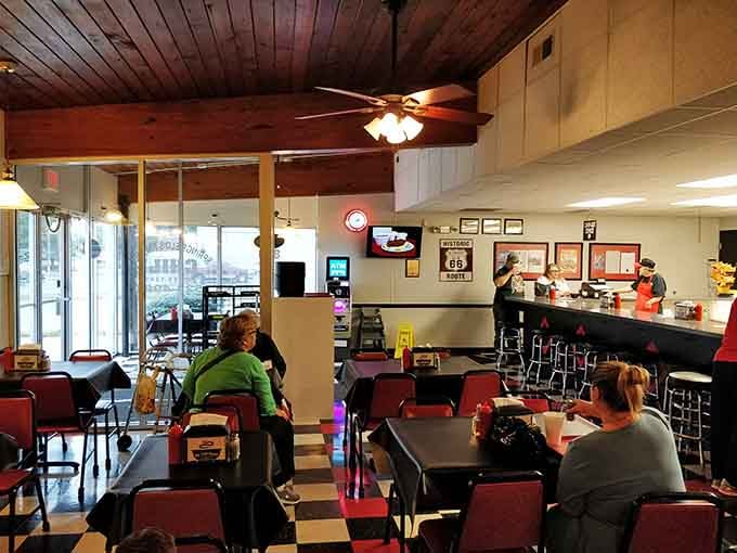 Classic diner vibes meet wood-paneled warmth where locals gather for their regular chili fix without fail.