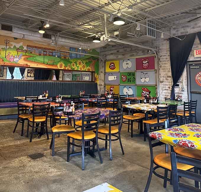 Colorful tables and playful wall art create a cheerful atmosphere that makes every morning feel like Saturday.