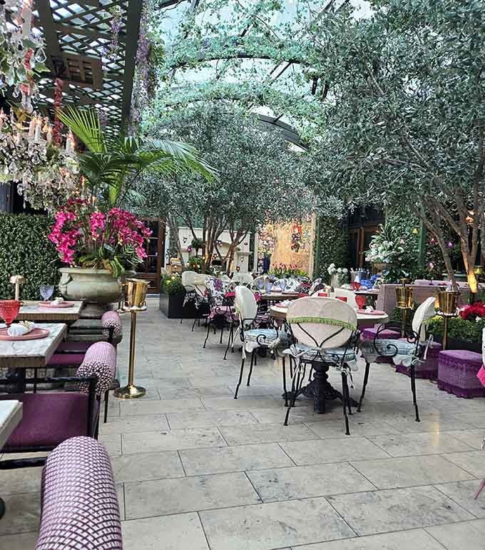 Dining under a canopy of trees indoors feels like discovering Narnia, but with better food and no talking lions.