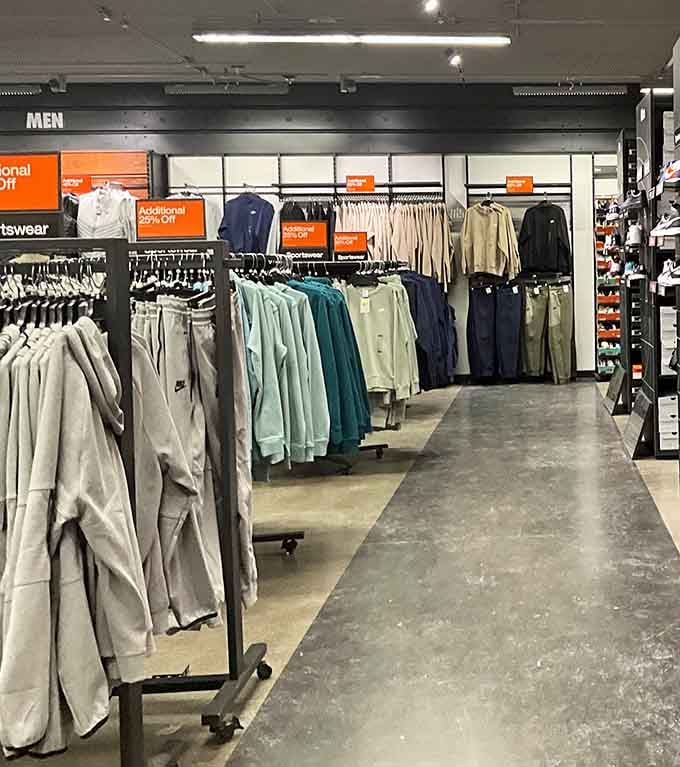 Men's clothing sections that actually make sense, organized by color like a well-planned closet intervention.