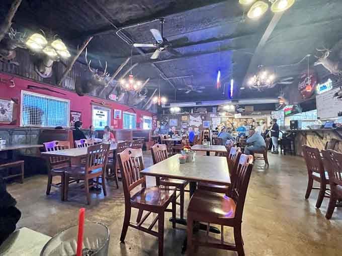 Mounted trophies overhead and wooden tables below create an atmosphere where hunters and families feel equally welcome.