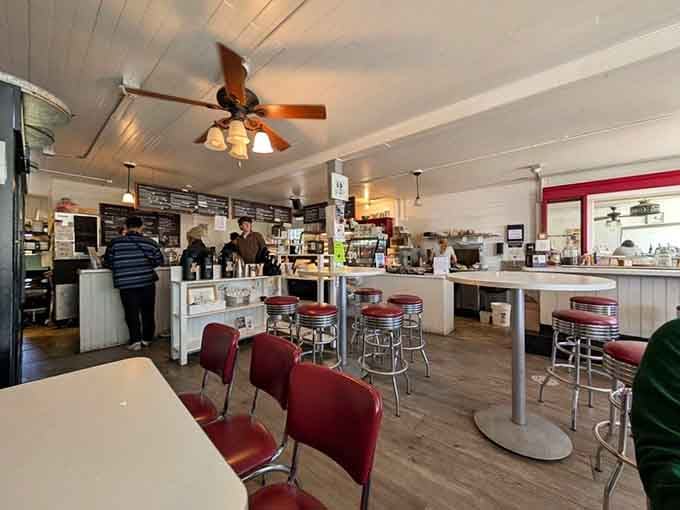 Classic diner stools and a friendly counter create the perfect setting for watching breakfast magic happen right before your eyes.