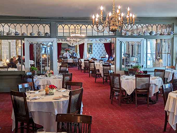 Crystal chandeliers and white tablecloths create an atmosphere where your phone stays in your pocket and conversation flows freely.
