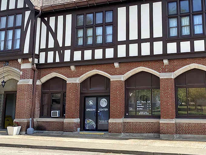 Those Earth and Moon graphics on the door are your first clue that something extraordinary awaits inside this historic building.