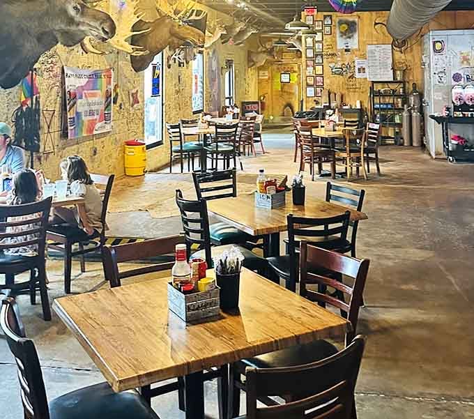 Inside, taxidermy meets dive bar chic, where moose heads watch over your meal like benevolent forest guardians.