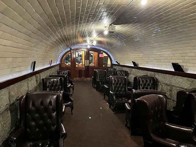 White painted brick curves overhead like a sophisticated subway car designed by someone with impeccable taste and deep pockets.