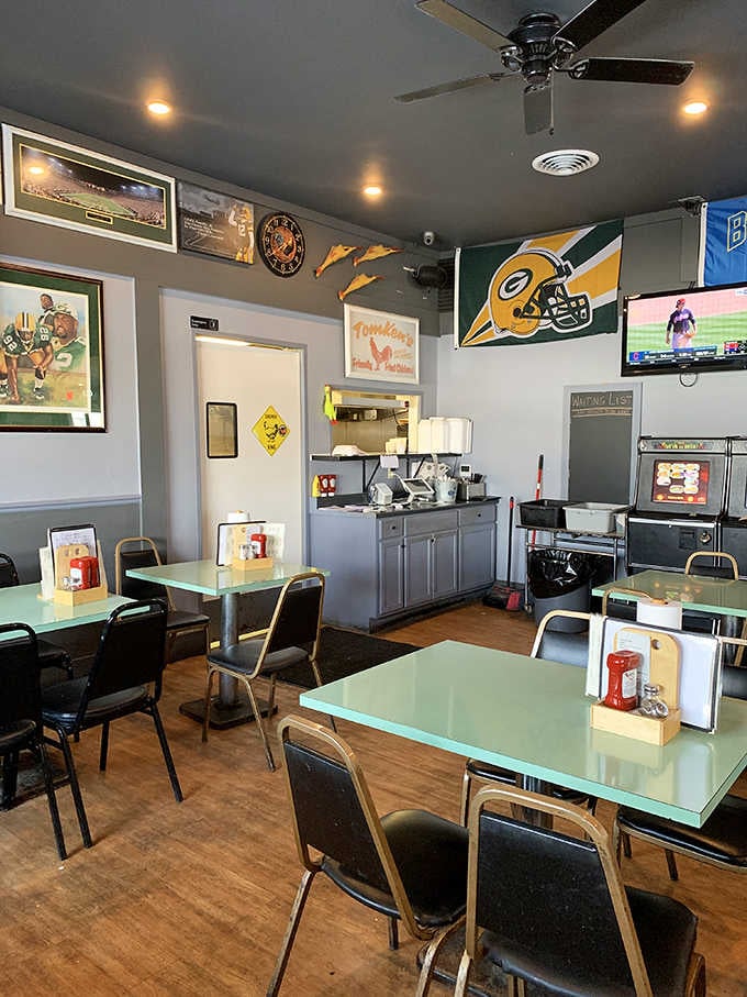Those turquoise tables and Packers memorabilia create the perfect Wisconsin dining atmosphere where everyone feels like family.