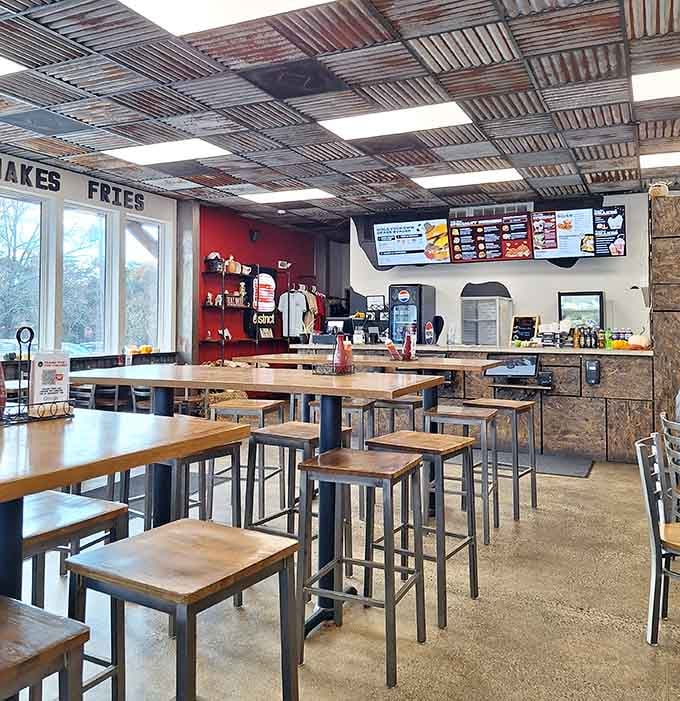 Industrial chic meets casual comfort where corrugated metal ceilings and simple wooden tables set the perfect no-fuss stage.