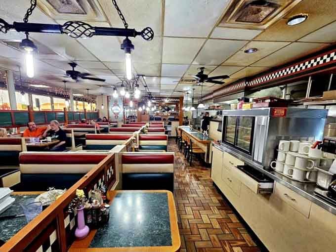 Classic diner booths stretching into the distance like a delicious promise you're about to keep with your appetite.