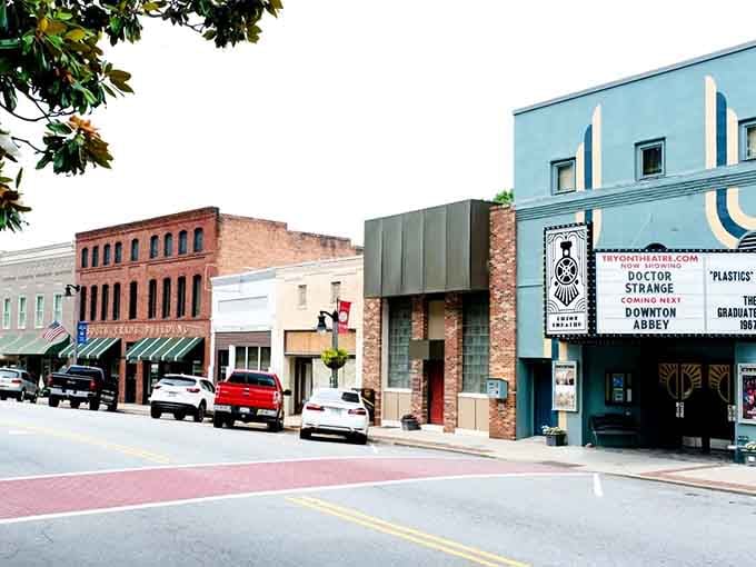 The Tryon Theatre marquee proves culture thrives in small towns that value entertainment and community gathering.