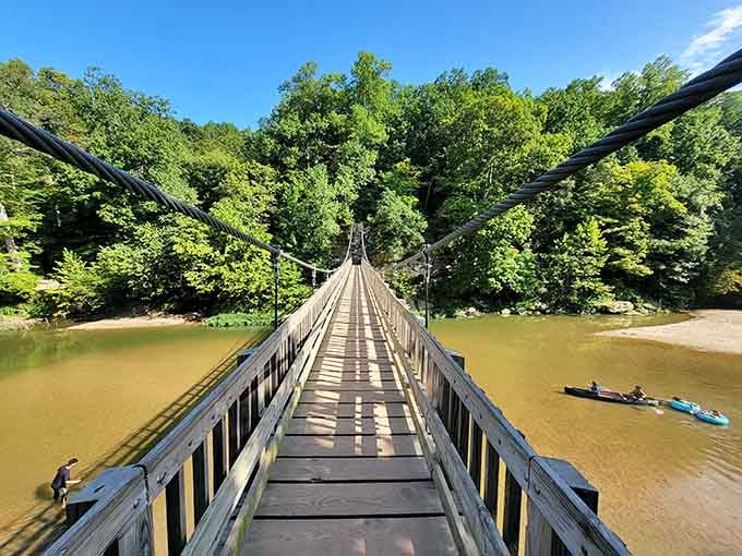 This swaying bridge stretches 245 feet across Sugar Creek, offering views that justify any white-knuckle moments.