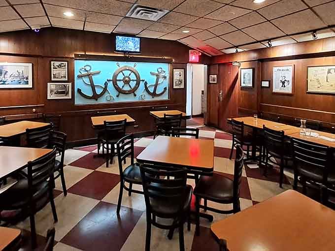 Wood paneling, nautical decor, and checkered floors create the perfect setting for serious barbecue business and casual conversation.