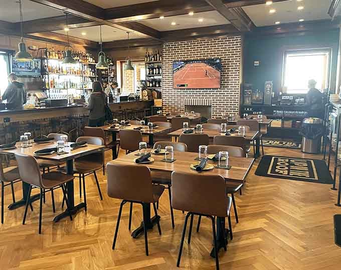 Inside, herringbone floors and brick walls create the kind of atmosphere that makes every meal feel like an occasion.