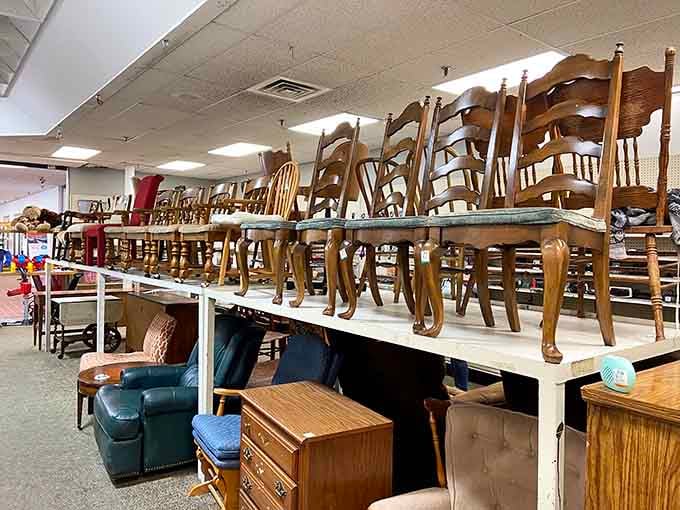 Chairs stacked like a wooden Jenga tower, each one ready to anchor your next dinner party.