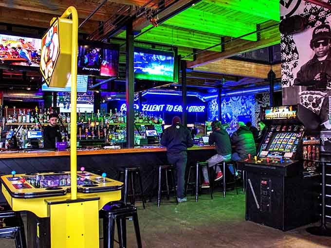 Neon lights and vintage games create an atmosphere that's part time machine, part happy hour heaven.