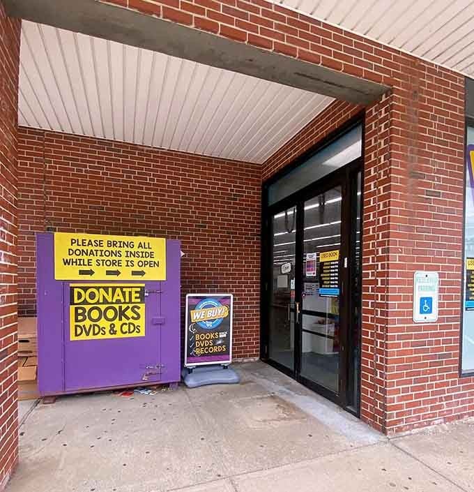 The purple donation bin is basically a portal where your old books become someone else's new treasures.